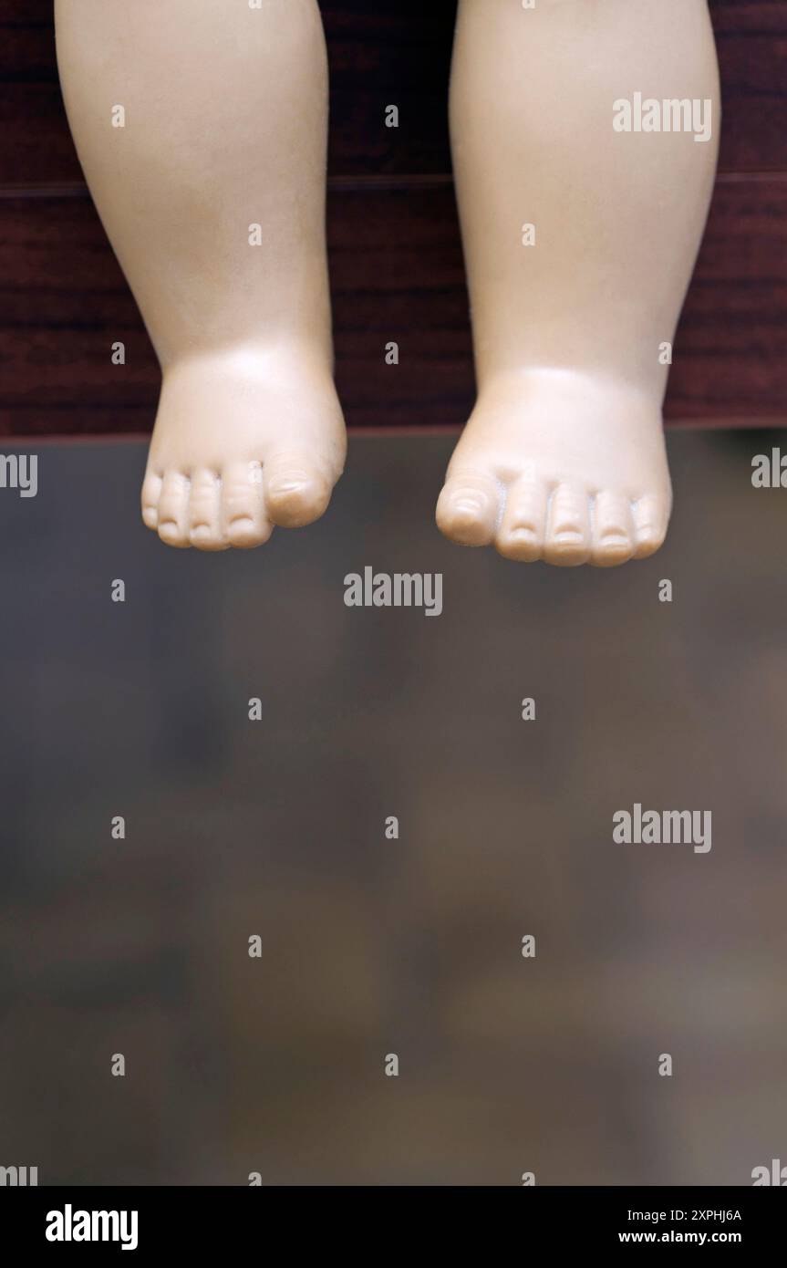 Doll dangling hi-res stock photography and images - Alamy