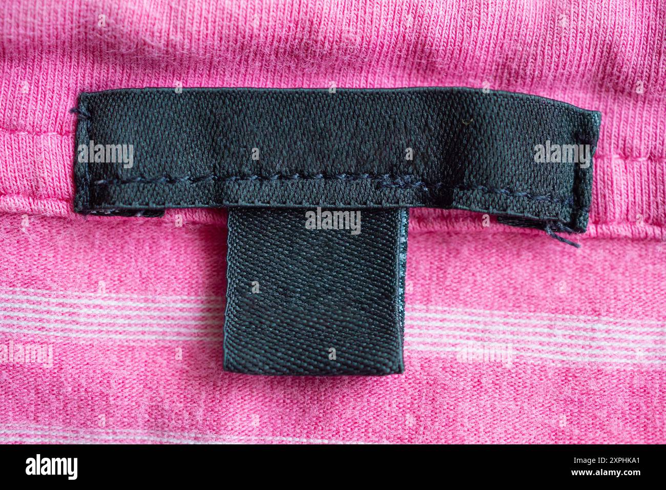 Blank black laundry care clothing label on fabric texture Stock Photo ...
