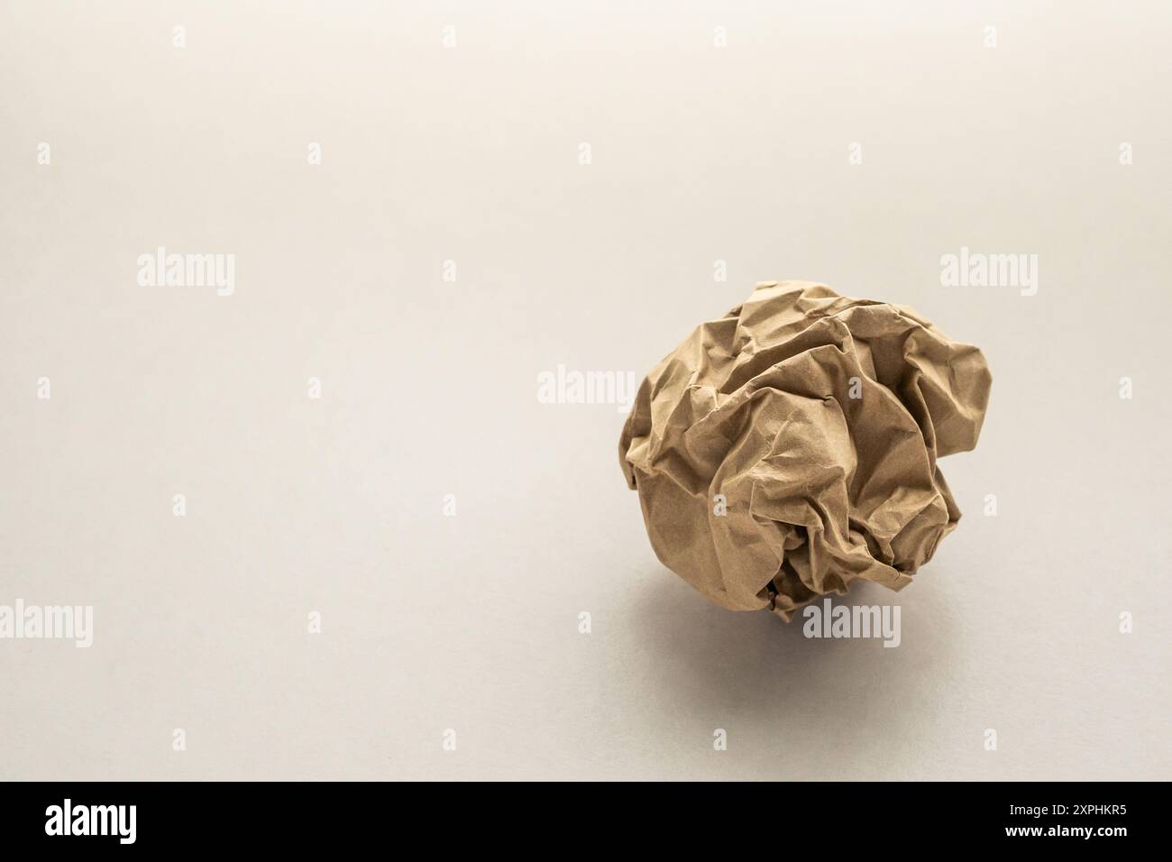 Crumpled recycle brown paper ball Stock Photo - Alamy