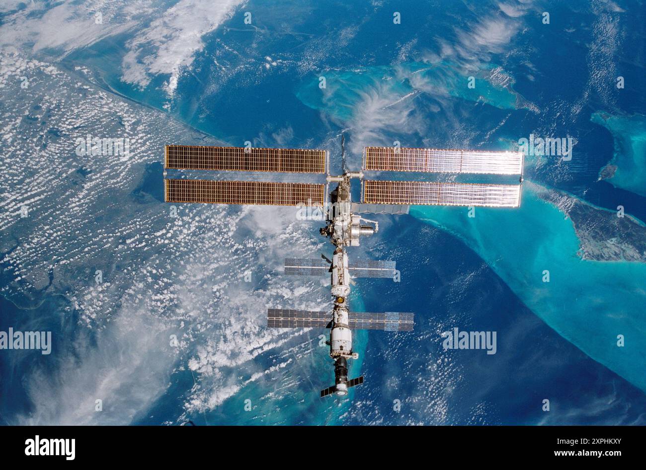 The International Space Station (ISS) is backdropped over Miami ...