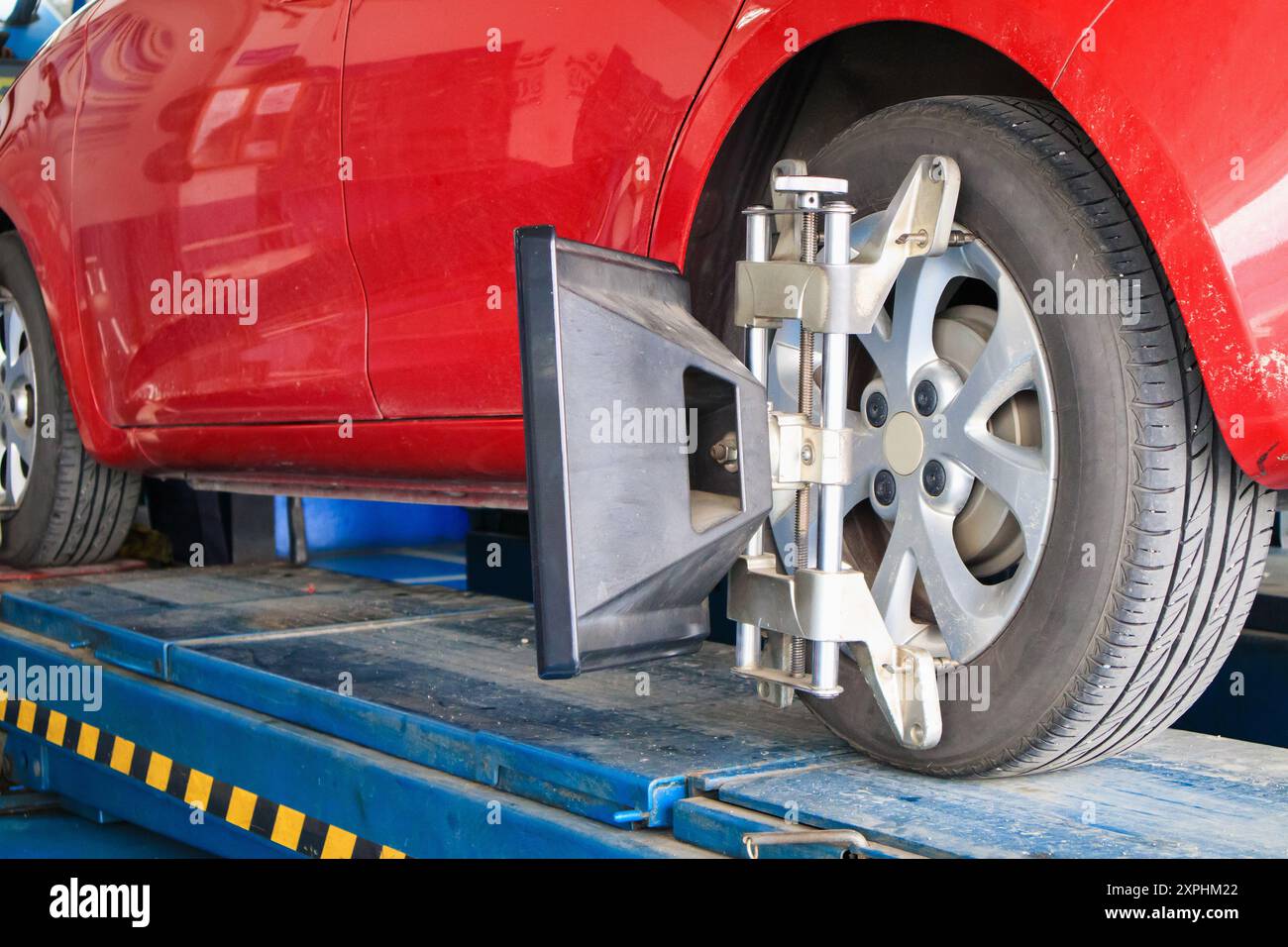 Car wheel alignment in progress at auto repair service centre Stock ...