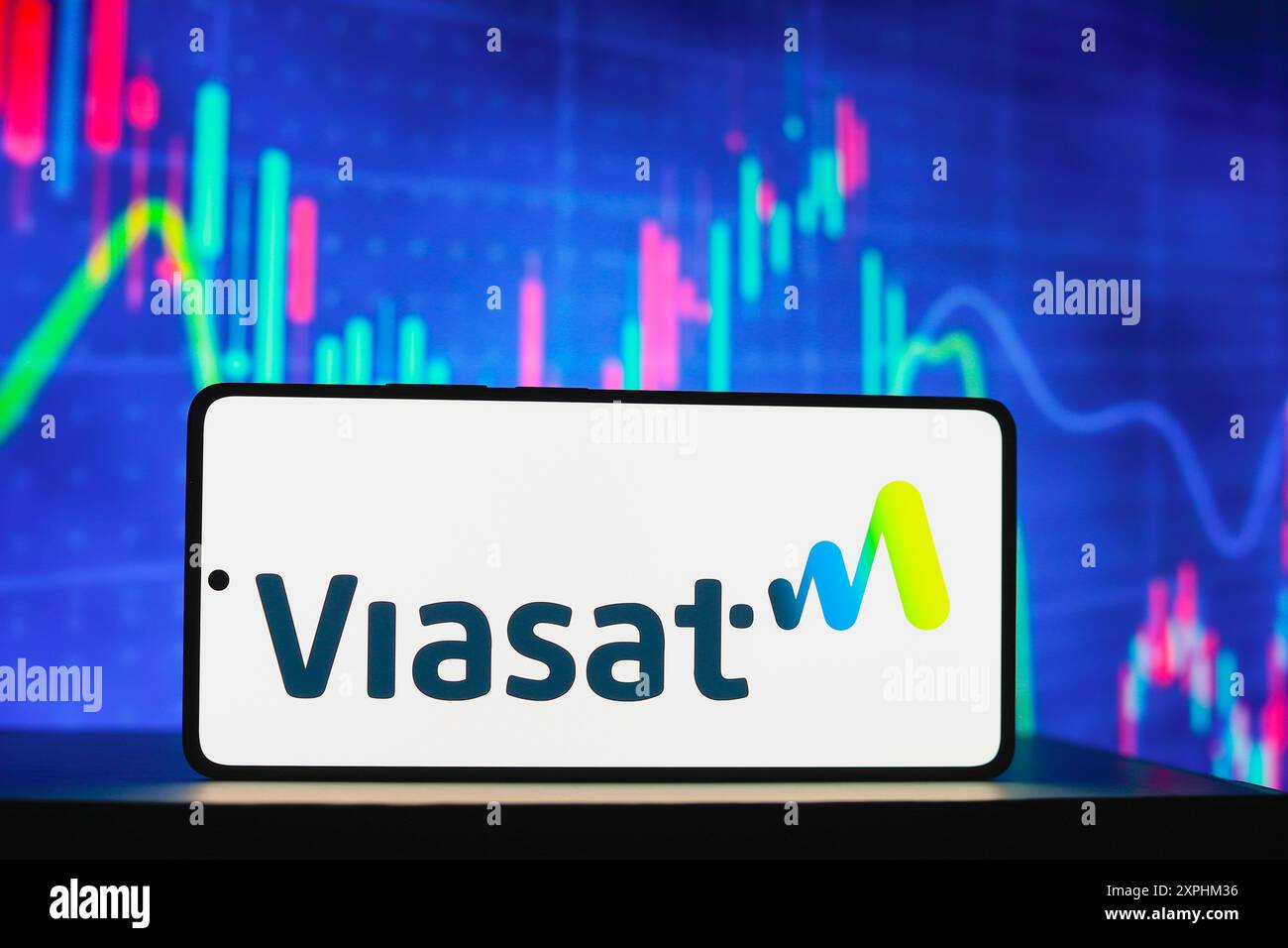 In this photo illustration, the ViaSat Inc. logo is displayed on a ...
