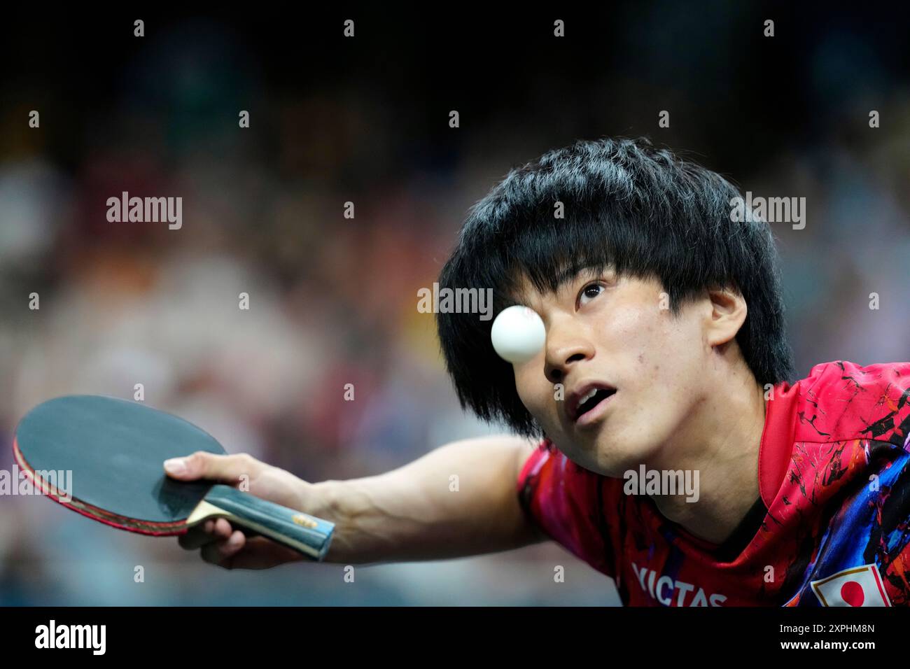 Japan's Shunsuke Togami plays against Taiwan's Kao Cheng-Jui during a ...