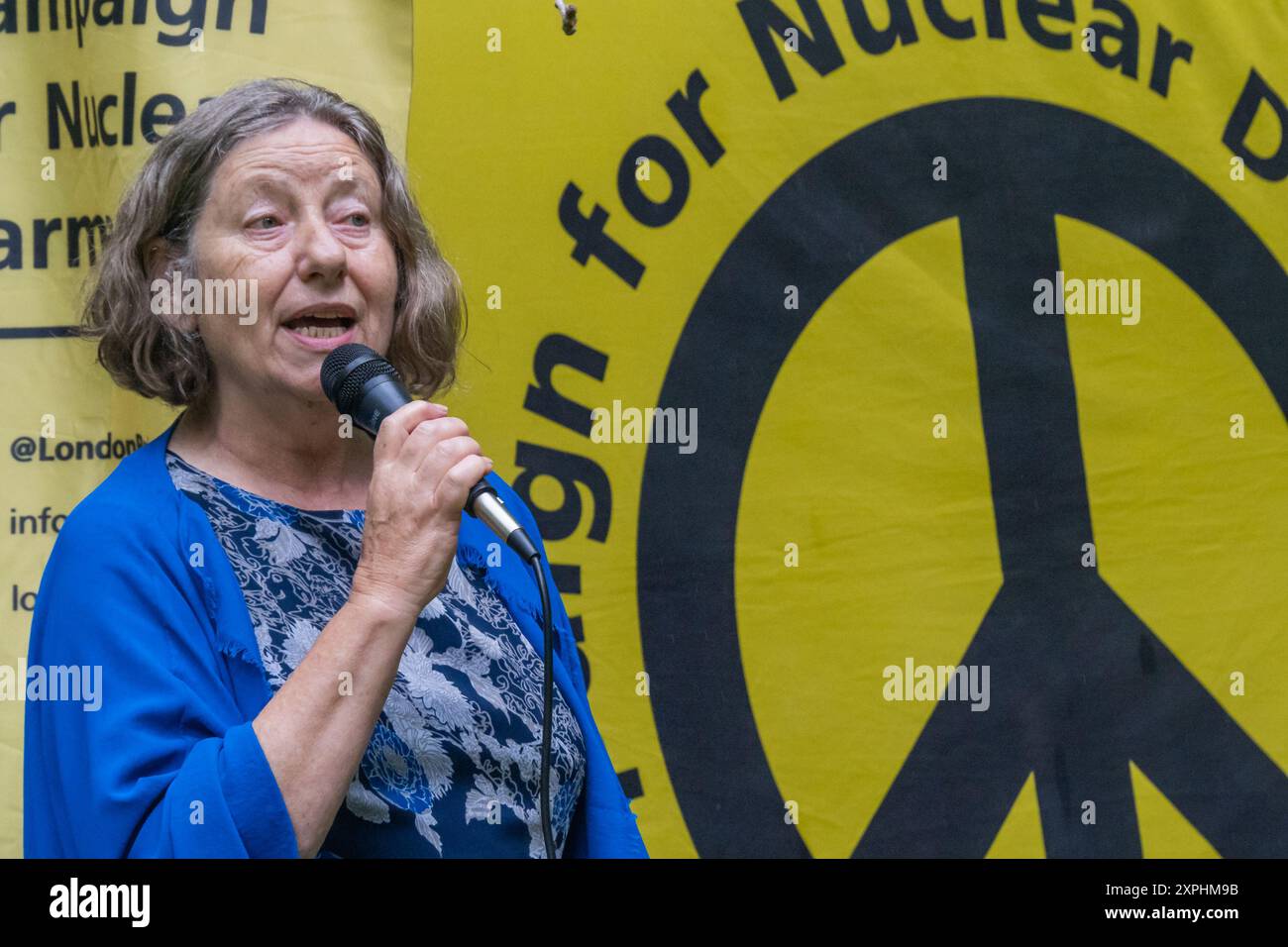 London, UK. 6 Aug 2024. A woman reads her poem correcting a statement ...