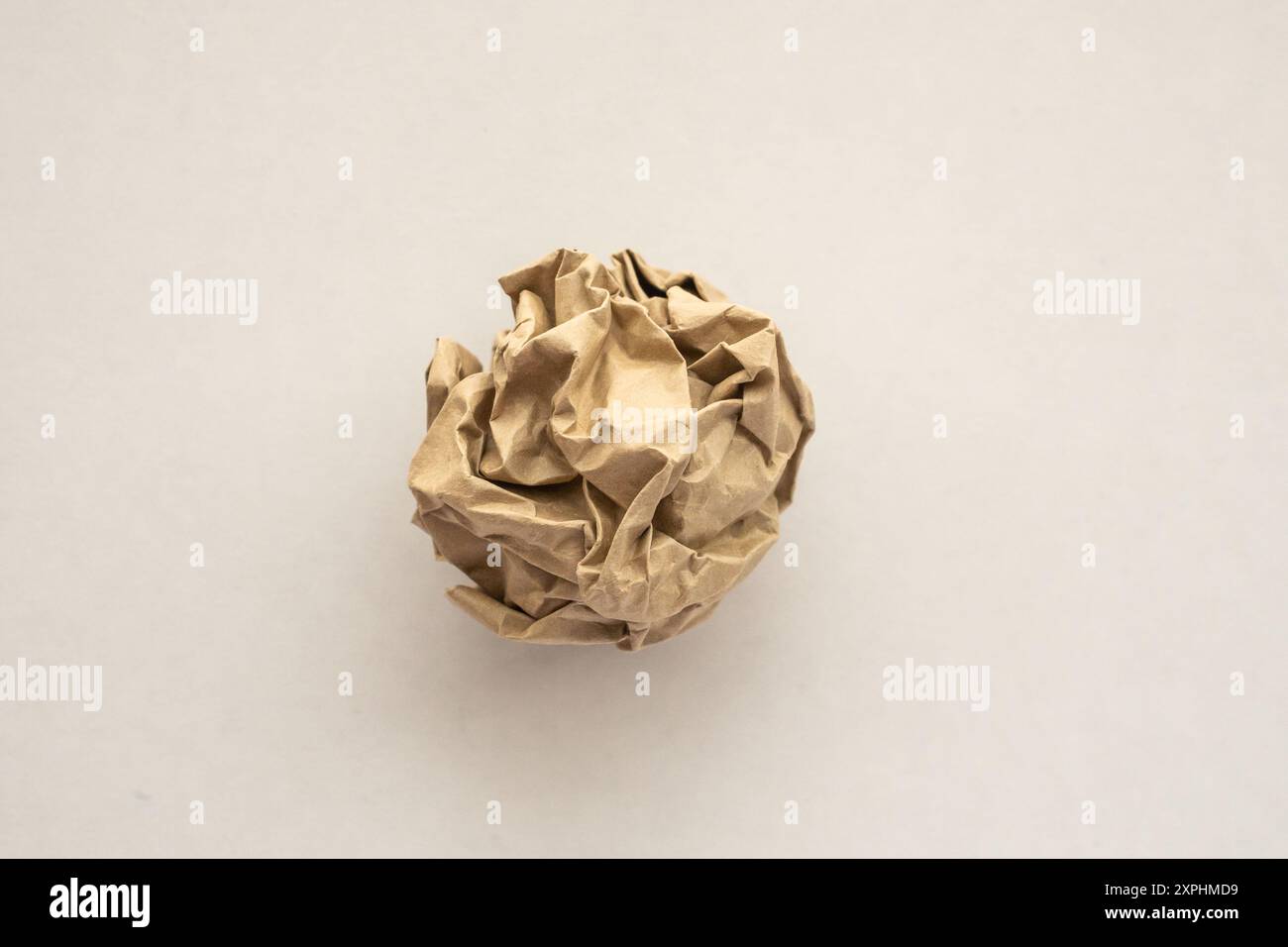 Crumpled recycle brown paper ball Stock Photo - Alamy