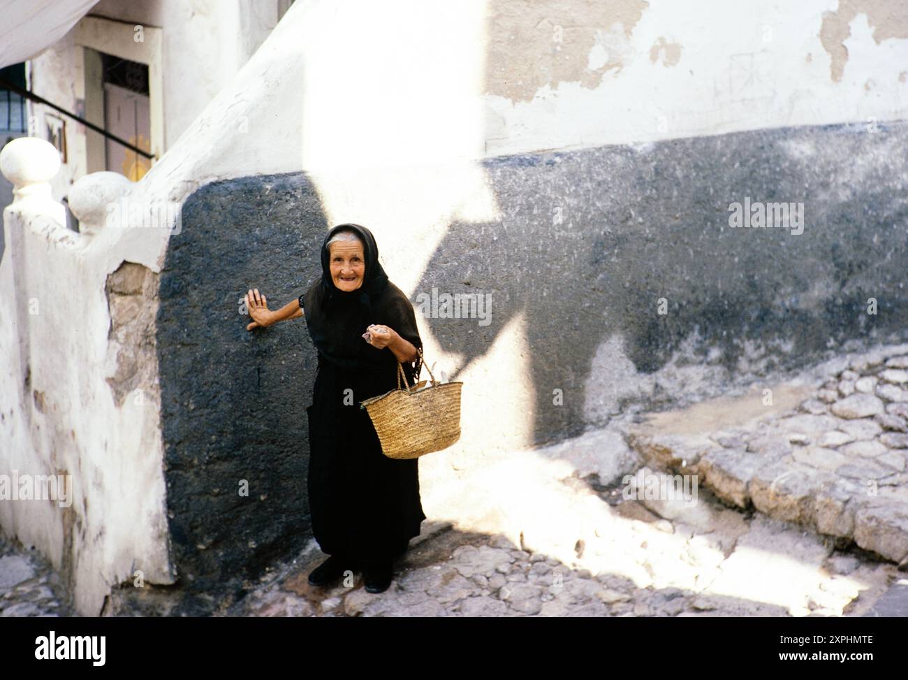 Old widow women wearing black clothing in Ibiza town, Ibiza, Balearic ...