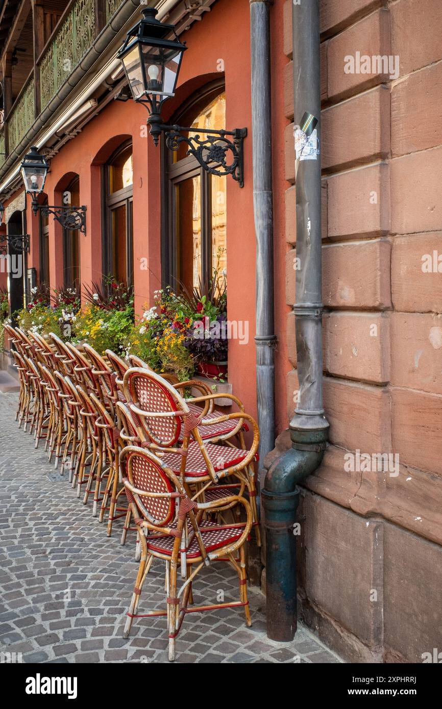 Typical scene outside a French cafe early in the morning with chairs ...