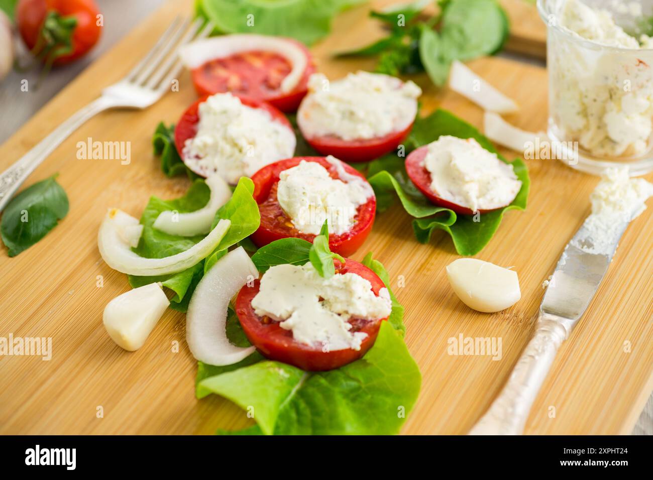 tomato wedges with cottage cheese filling and garlic, spicy appetizer ...