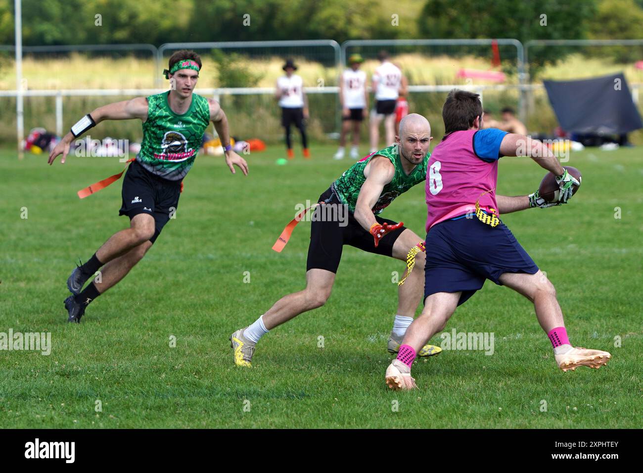 Offence vs Defence in a game of male flag football Stock Photo - Alamy