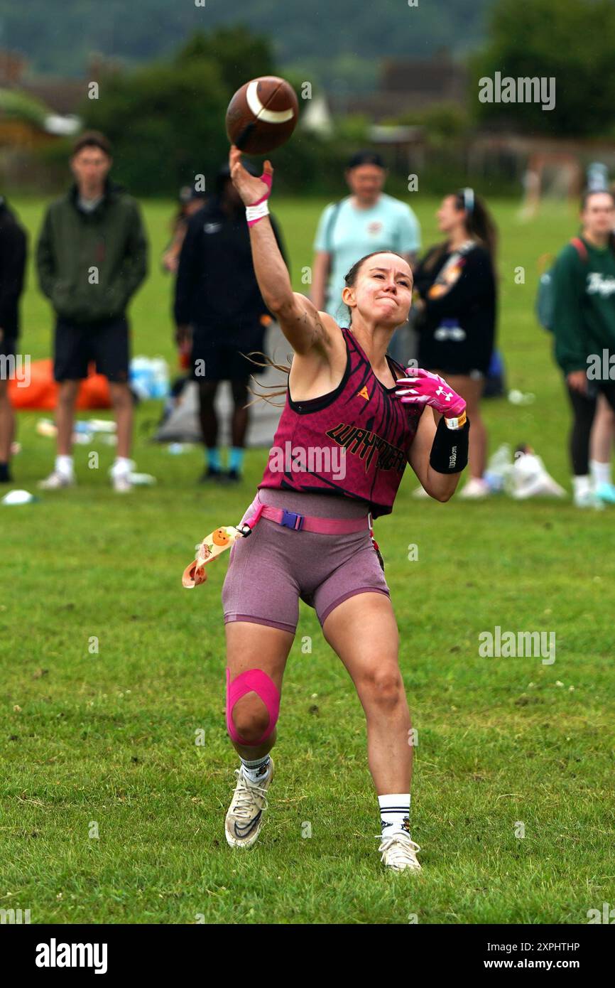 A female flag football quarterback throws the ball Stock Photo - Alamy