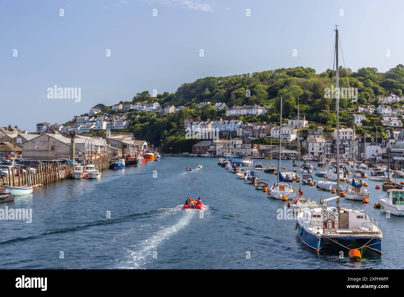 Looe Harbour full of pleasure craft and boats under beautiful Summer ...