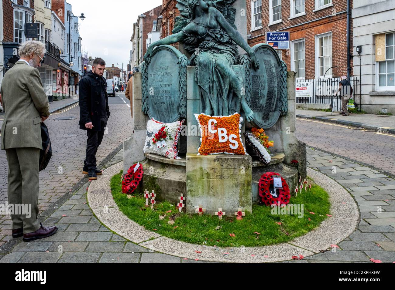 Local People Paying Respects At The Town War Memorial, Lewes, East ...