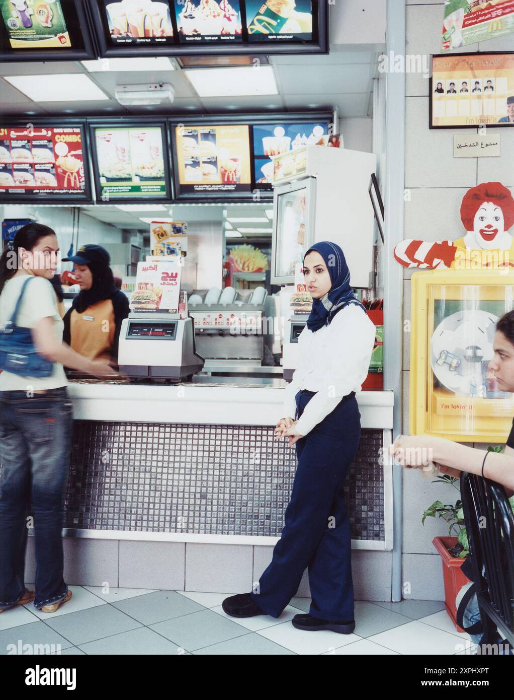 Interior view of a fast food restaurant in Alexandria, Egypt. Customers ...