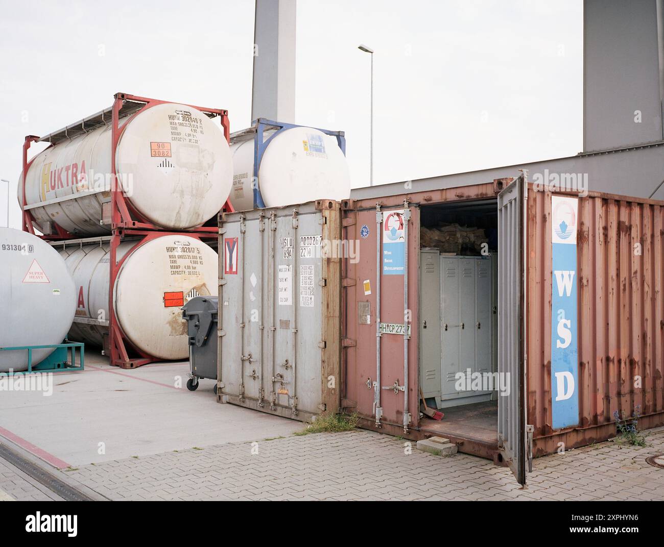Containers and large cylindrical tanks in a shipping terminal in ...