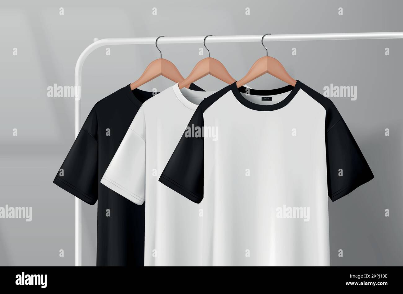 Black and white t-shirts hanging on a clothes rack in a studio on a ...