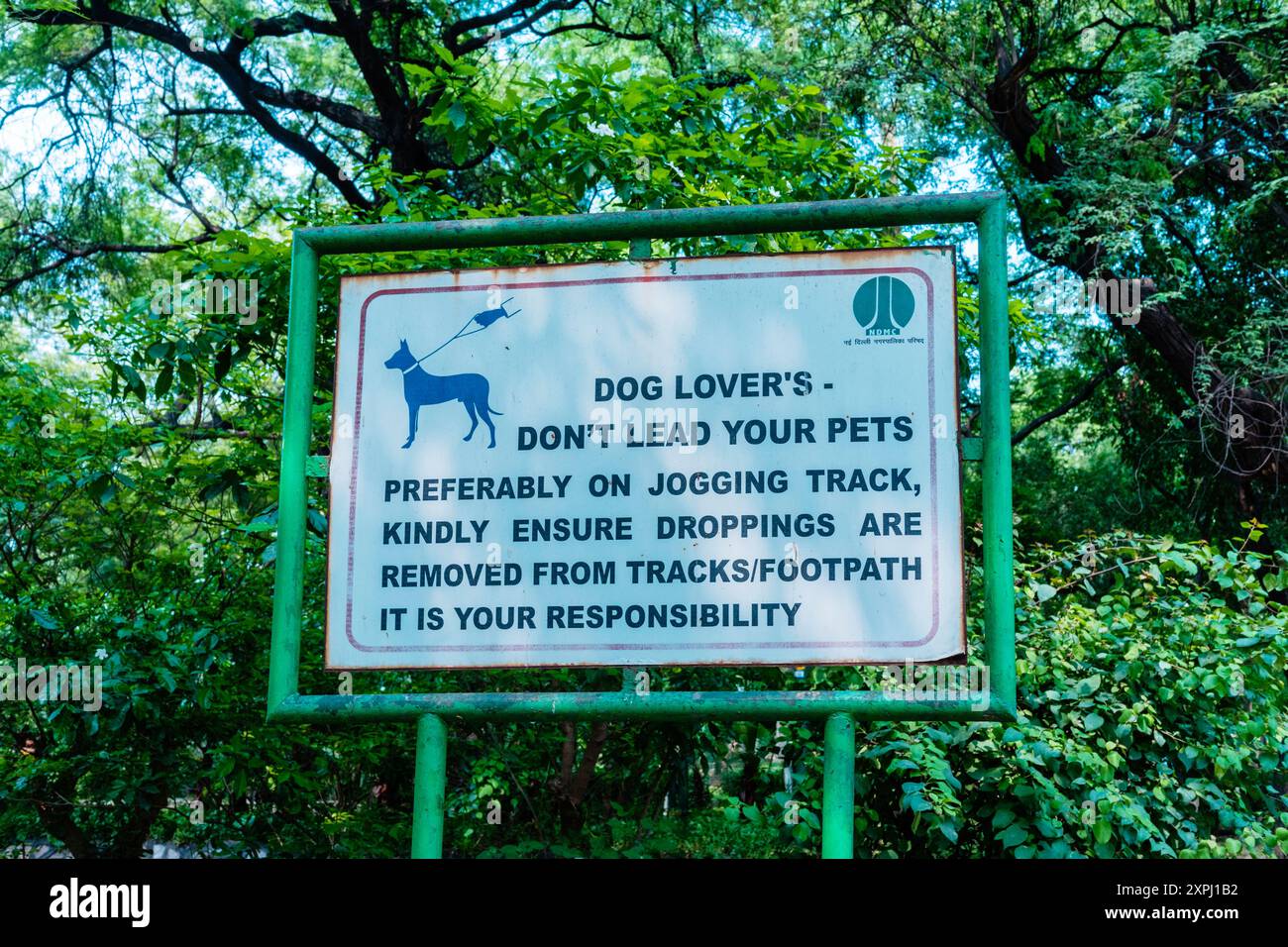 Indian signboards: Dog manners Stock Photo - Alamy