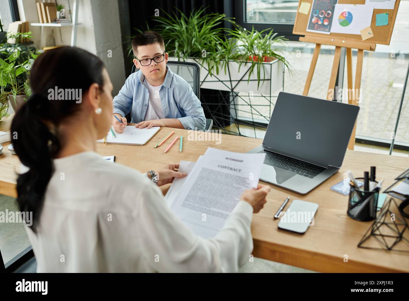 Mother works on documents hi-res stock photography and images - Alamy