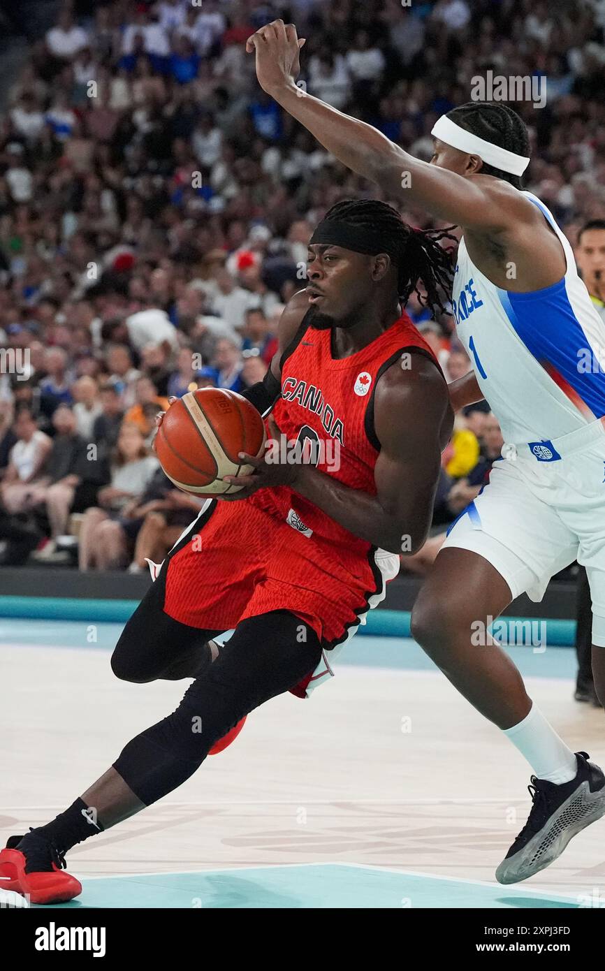 Paris, France. 06th Aug, 2024. Luguentz Dort of Canada (0) drives to ...
