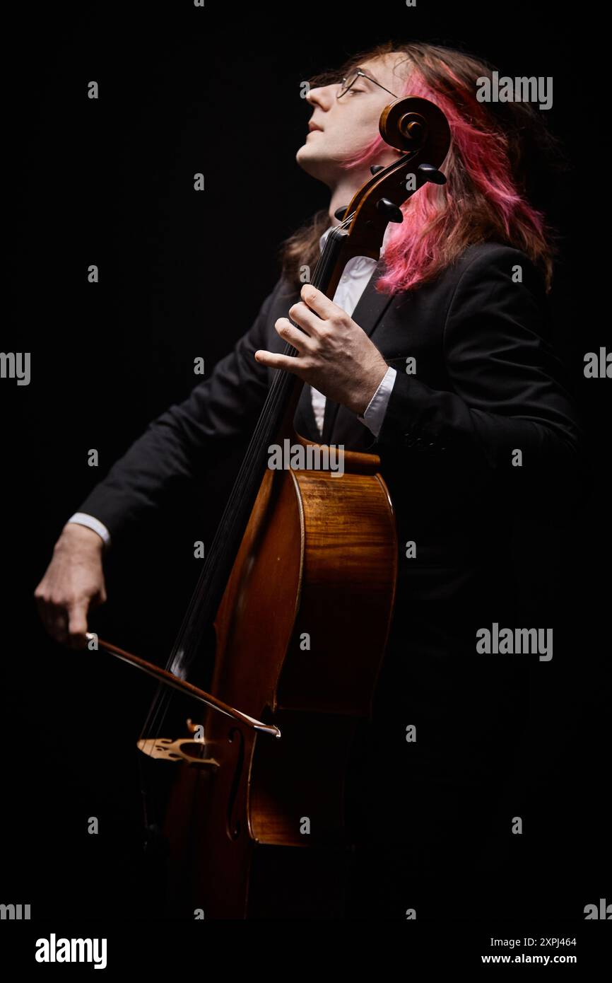 Cello player in orchestra hi-res stock photography and images - Alamy