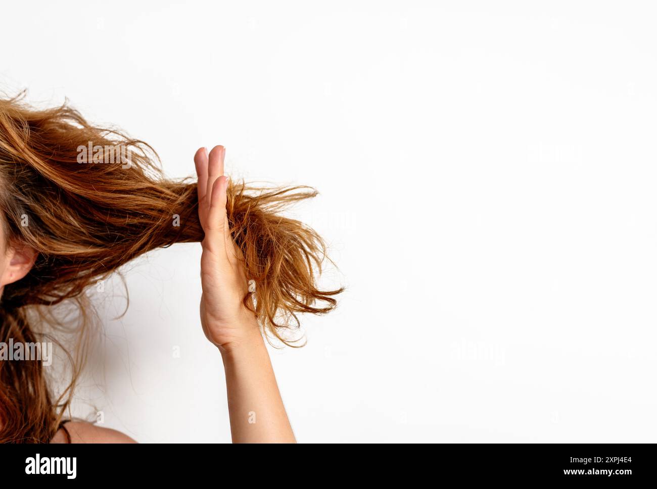 Hair problems. Female person showing her dry damaged hair. Hair in hand ...