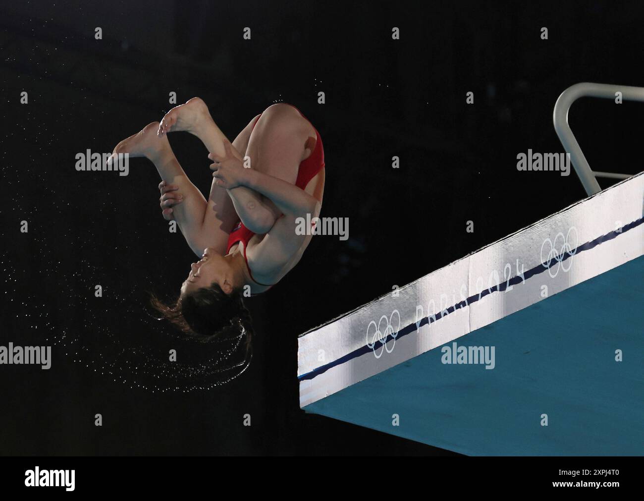 KIM Mi Rae of North Korea performs during the women's diving 10-meter ...