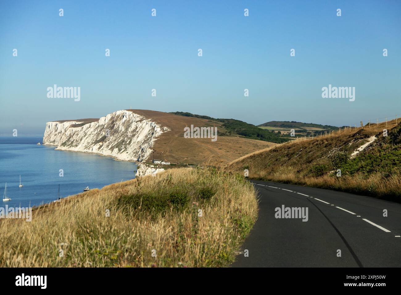 The Isle of Wight coastline towards Freshwater Bay, with a blue sky ...