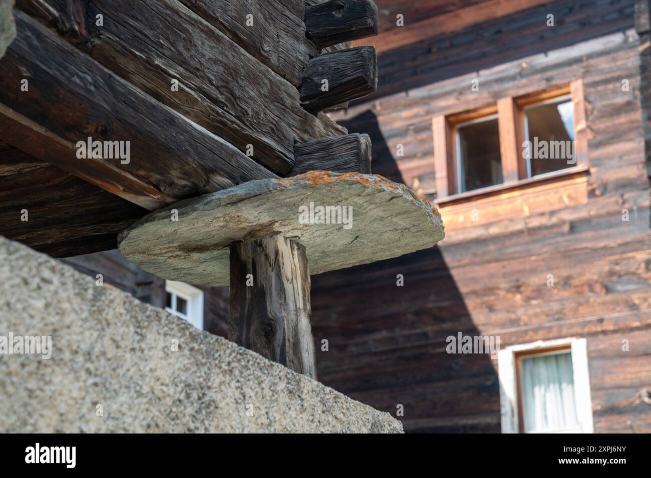 Old chalet in Zermatt Switzerland on flat stone slab stilts to prevent ...