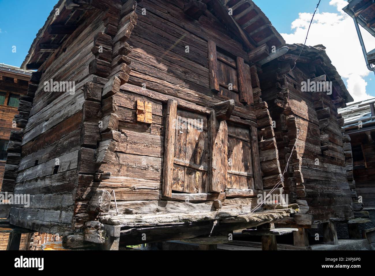 Old chalet in Zermatt Switzerland on flat stone slab stilts to prevent ...