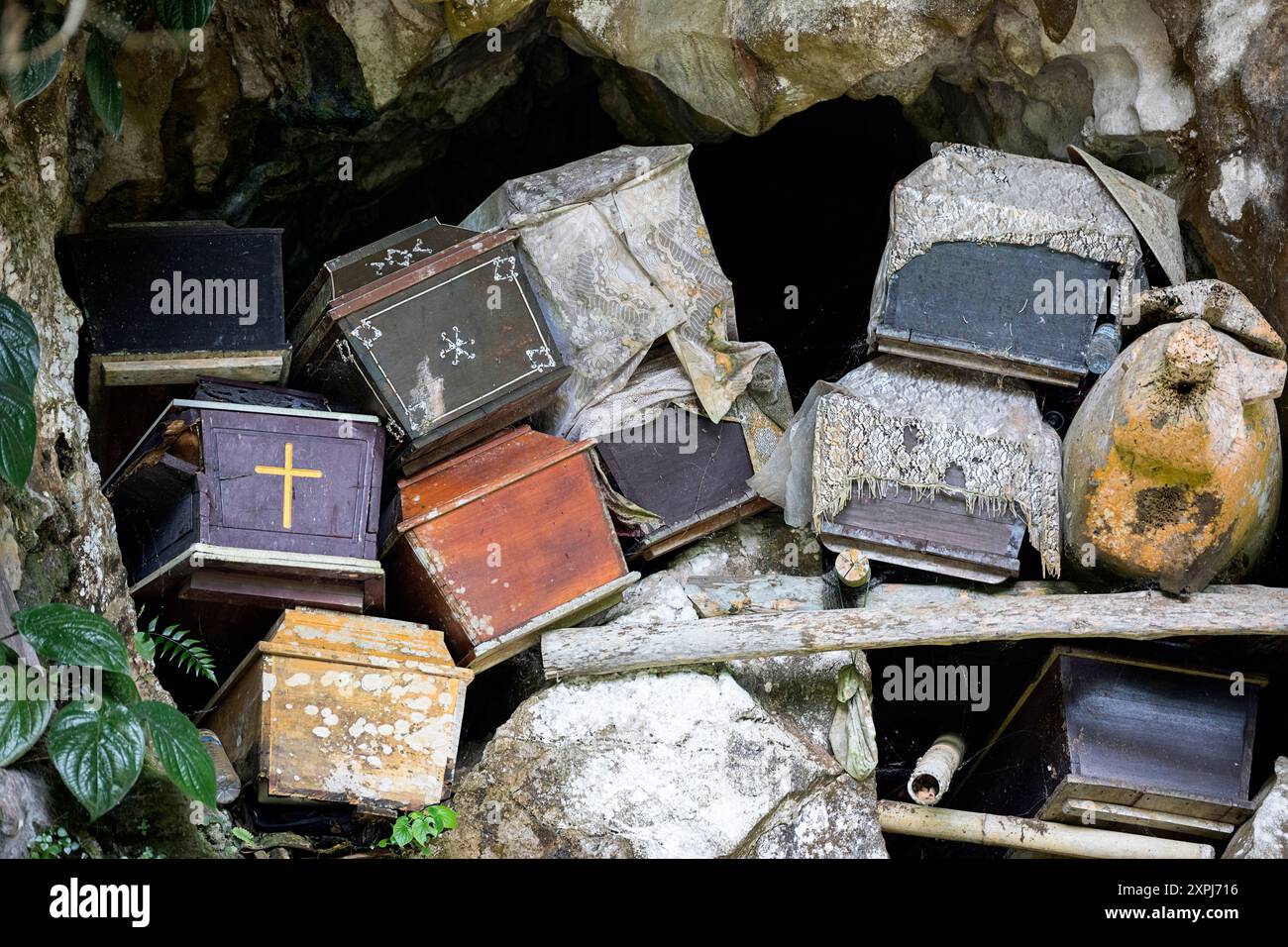 Old coffins with human remains at the entrance of a cave at Londa ...