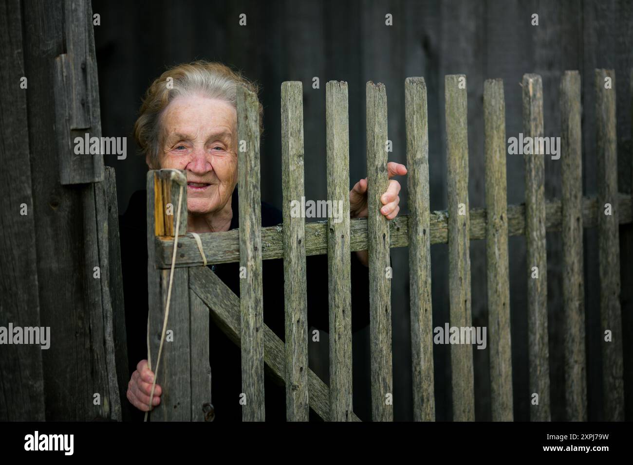 Woman behind fence close hi-res stock photography and images - Alamy