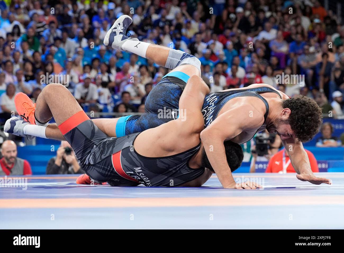 Iran's Mohammadhadi Saravi and Egypt's Mohamed Gabr compete during ...