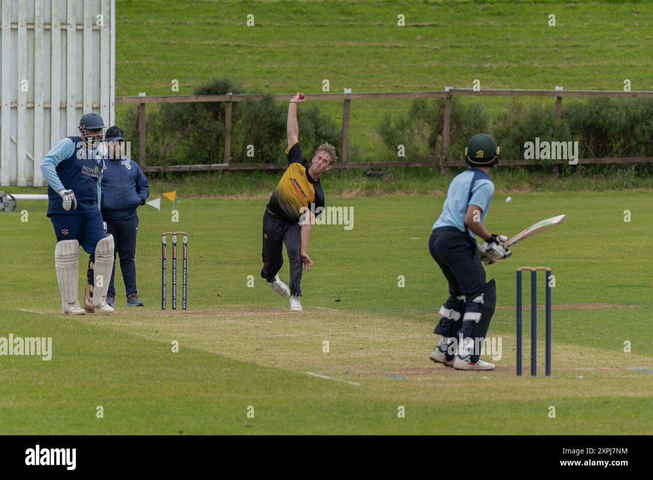 Bowler running in to Bowl in a game of cricket Stock Photo - Alamy