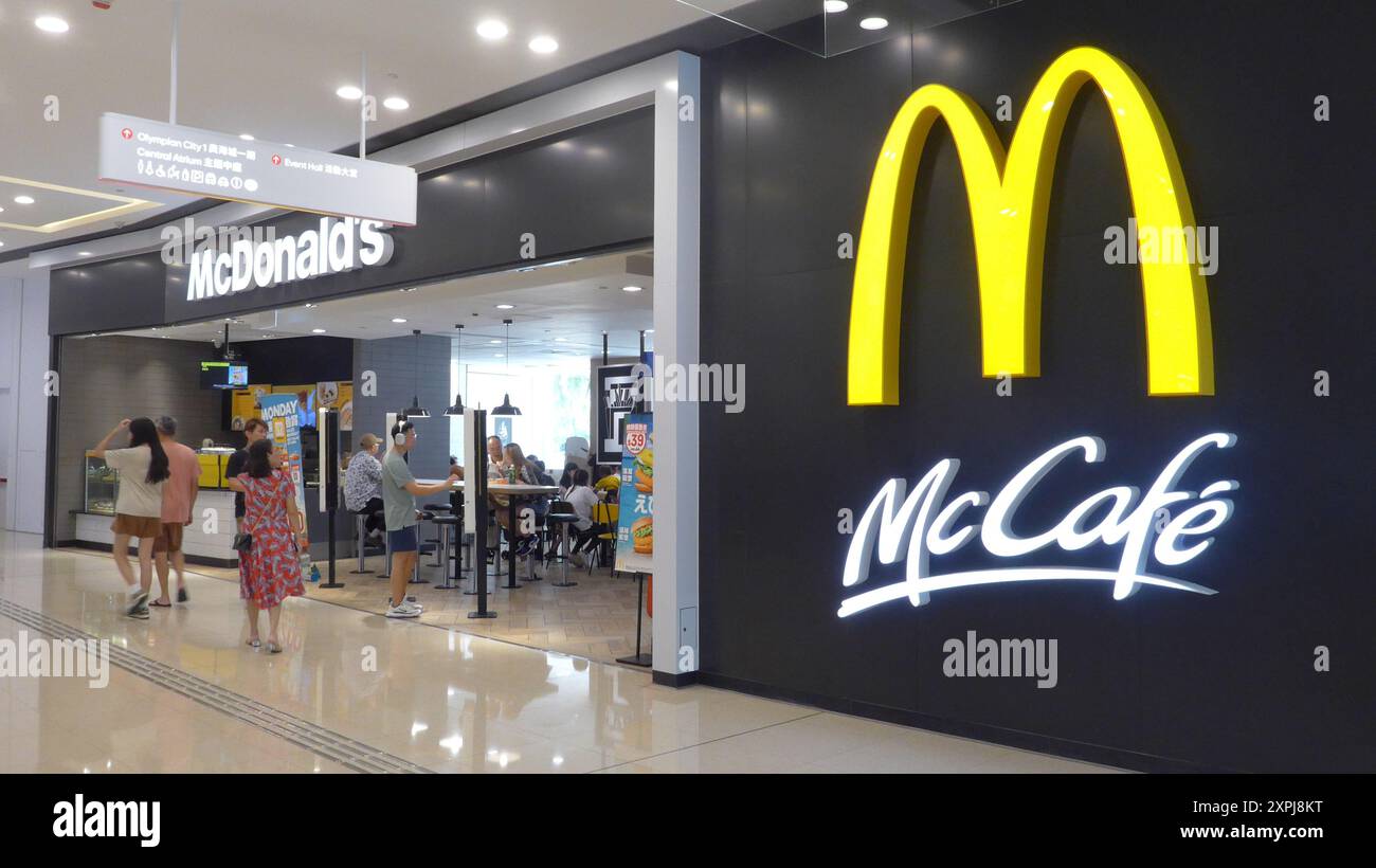 Customers are seen ordering for food in an automated self-ordering ...