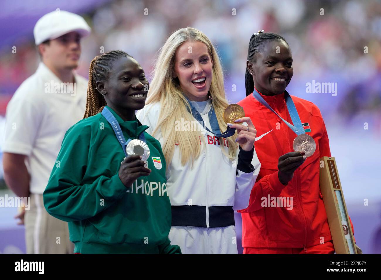 Silver medalist Tsige Duguma, of Ethiopia, from left, gold medalist ...