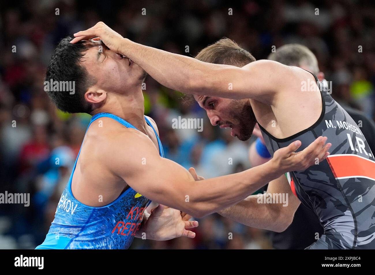 Iran's Mehdi Mohsen Nejad, right, and Kyrgyzstan's Zholaman ...