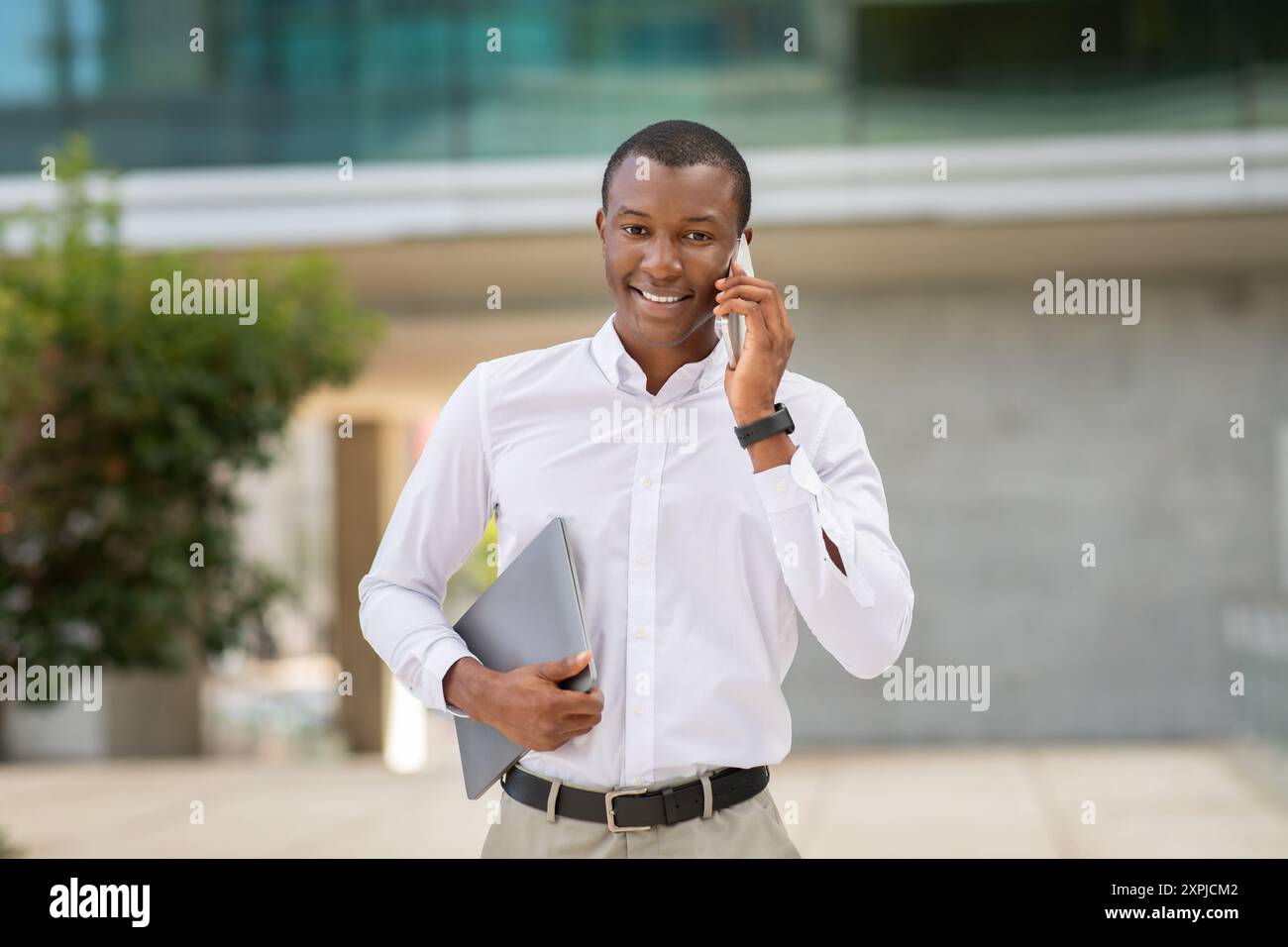 Smiling young man outside office hi-res stock photography and images ...