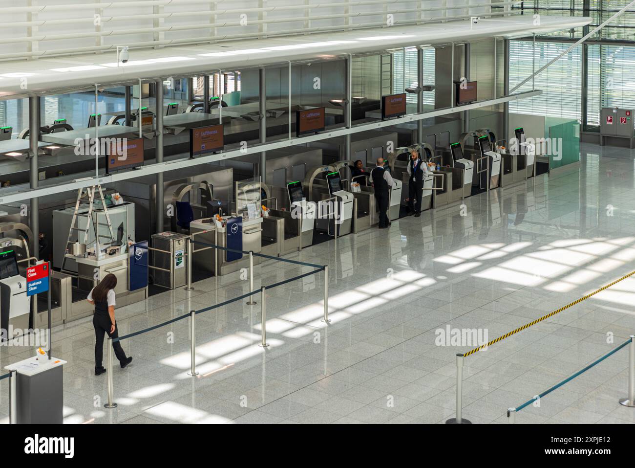MUNICH AIRPORT, GERMANY, AUGUST 8, 2024 : Automated self check-in and ...