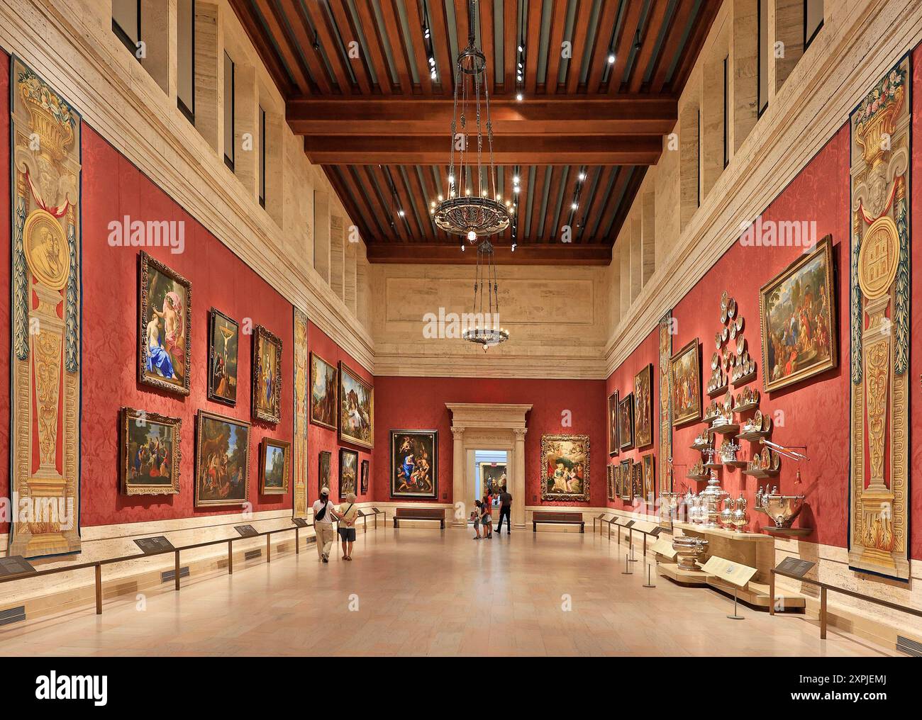 Visitors looking at art works in Boston Fine Art museum hall. Visitors ...