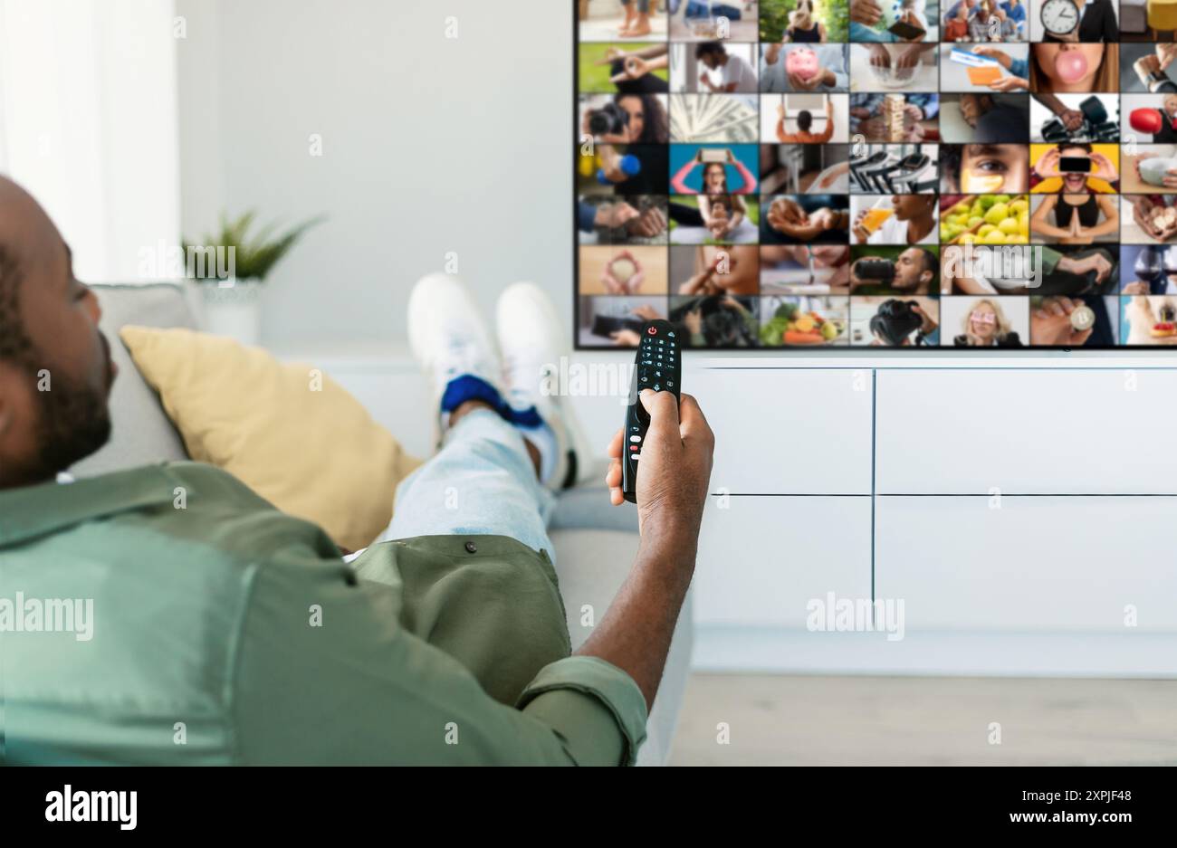 Man relaxing on couch with feet up hi-res stock photography and images ...
