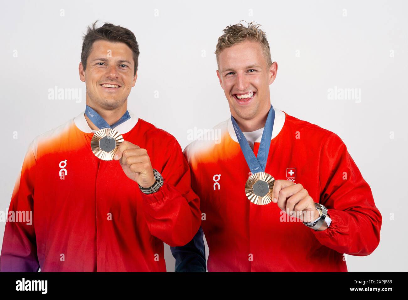 Switzerland's men's pair rowing bronze medalists Andrin Gulich, right ...