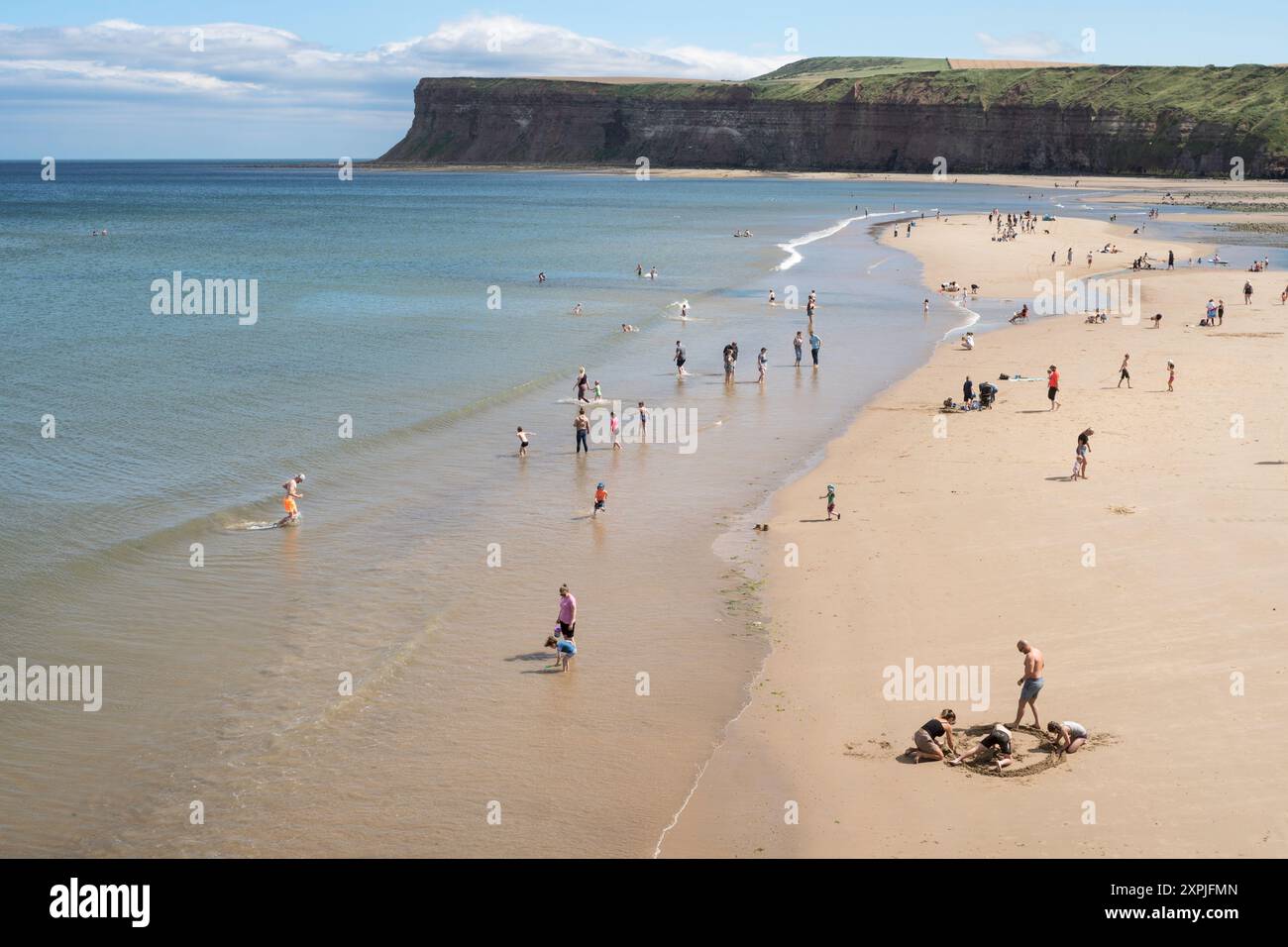 People enjoying summer sunshine on the beach at Saltburn-by-the-Sea ...