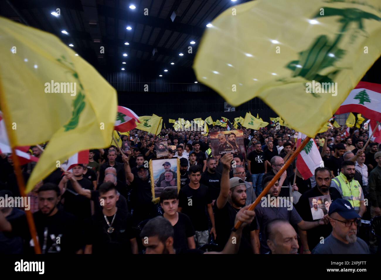 Beirut, Lebanon. 6th Aug, 2024. Hezbollah supporters wave flags during ...