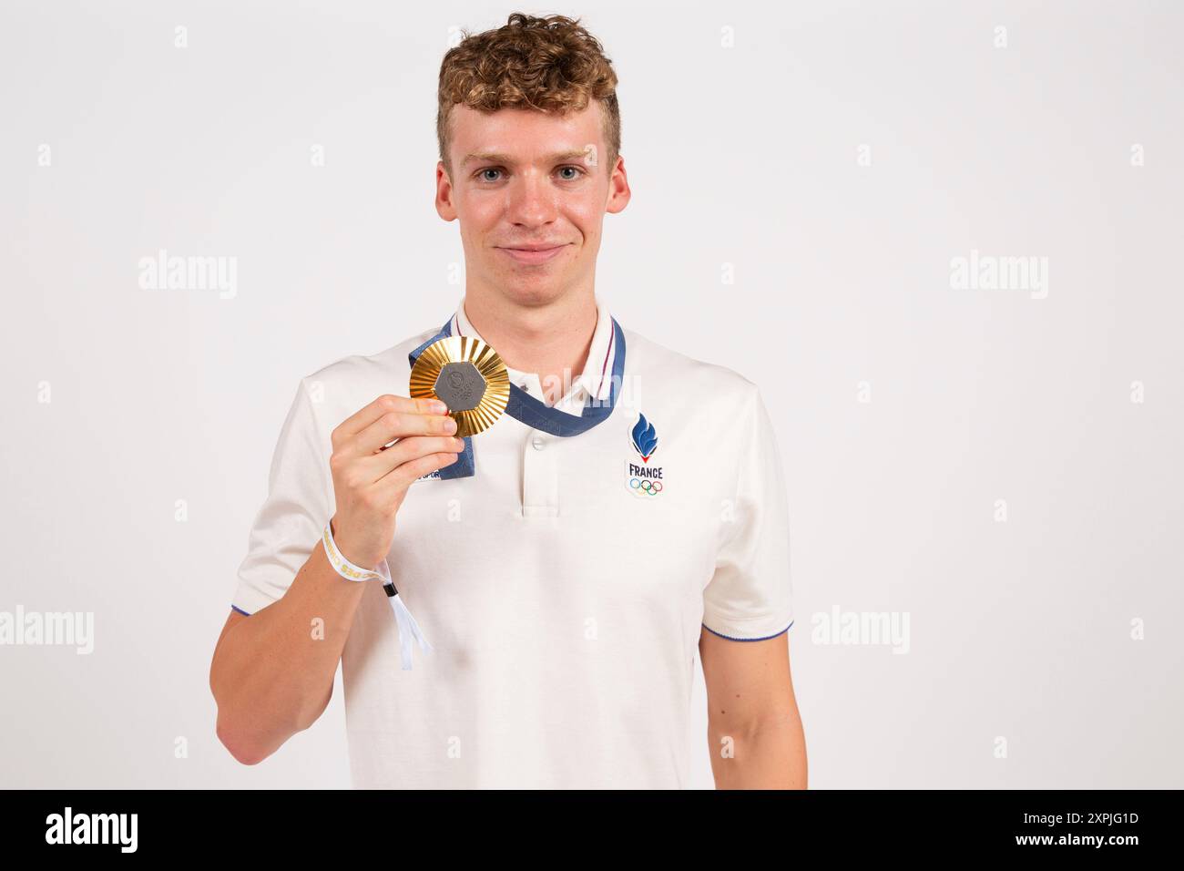 France's swimming gold medalist Leon Marchand poses for a portrait ...