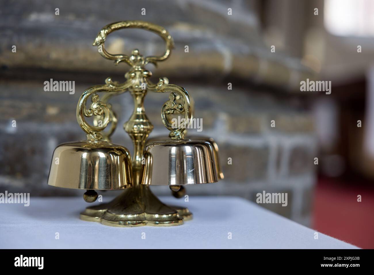 Copper bells as traditionally used during catholic mass at the moment ...
