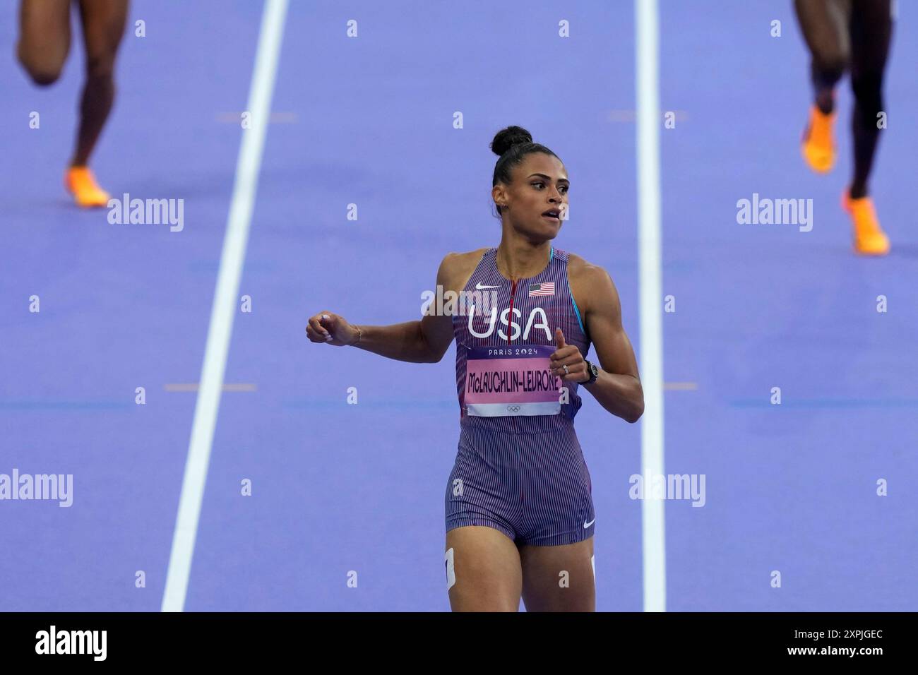 Sydney McLaughlin-Levrone, of the United States, crosses the finish ...