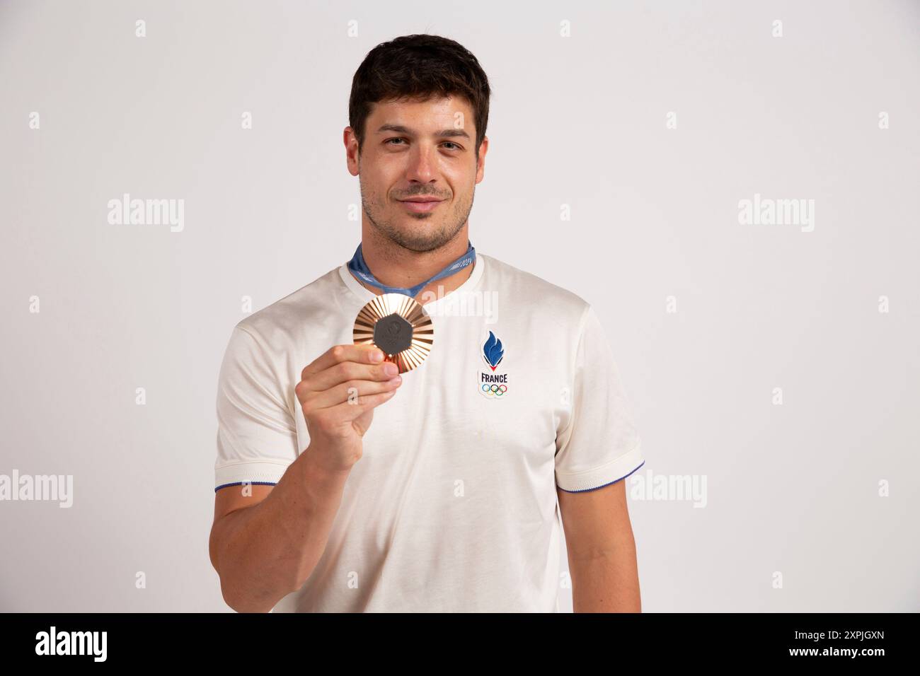 France's men foil team and bronze medalist Maxime Pauty poses for a ...