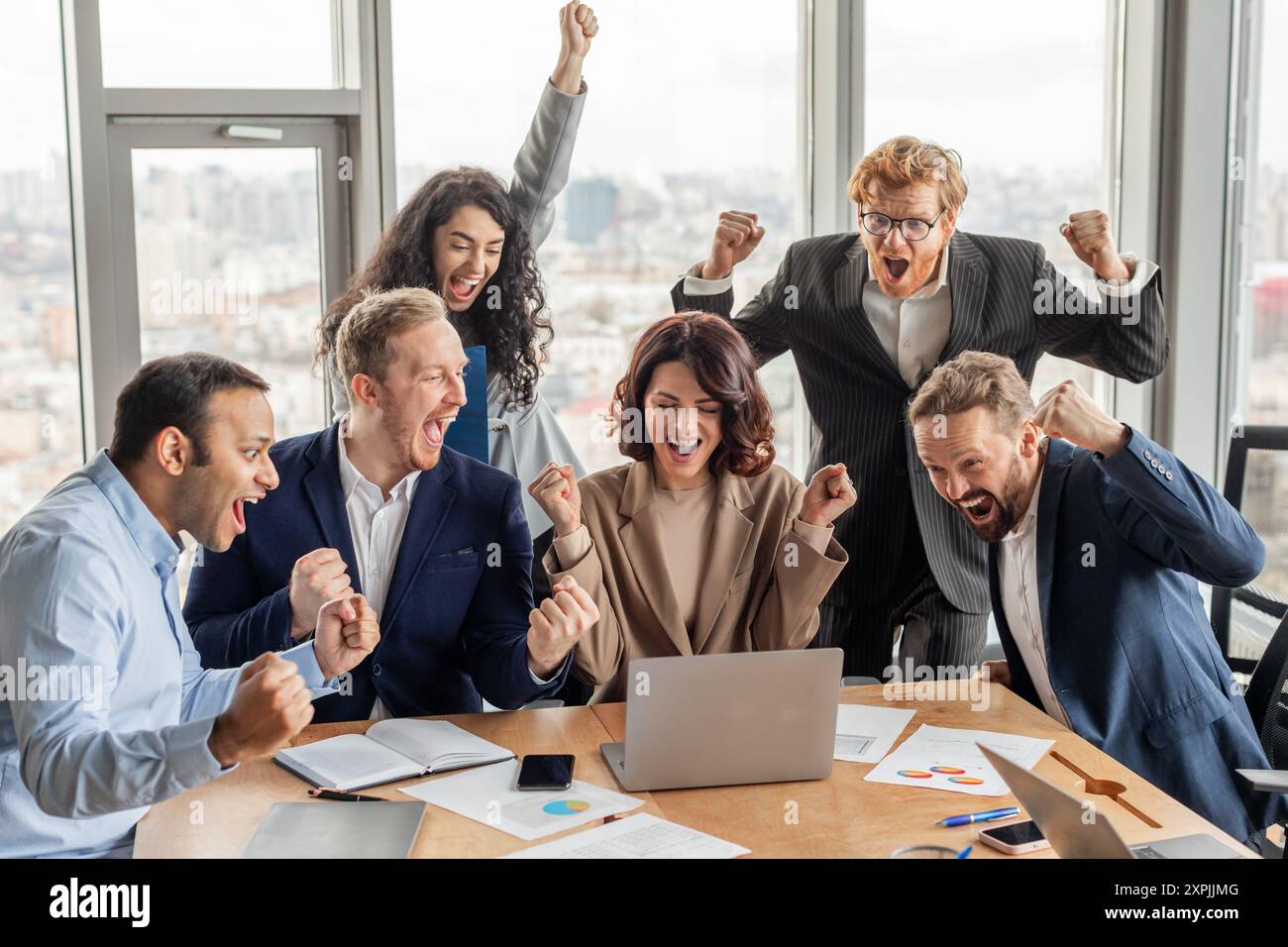 Excited Business Team Celebrating Success at Modern Office Stock Photo ...