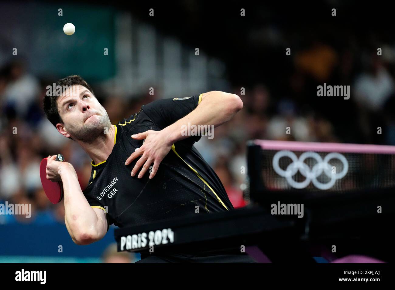 Germany's Dimitrij Ovtcharov plays against Sweden's Truls Moregard during a men's teams ...