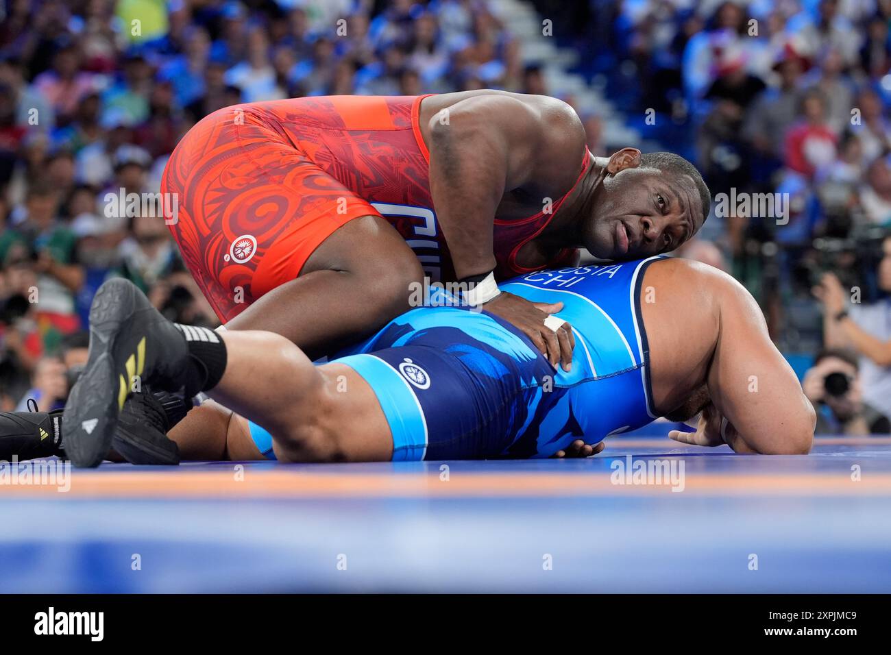 Cuba's Mijain Lopez Nunez and Chile's Yasmani Acosta Fernandez compete ...