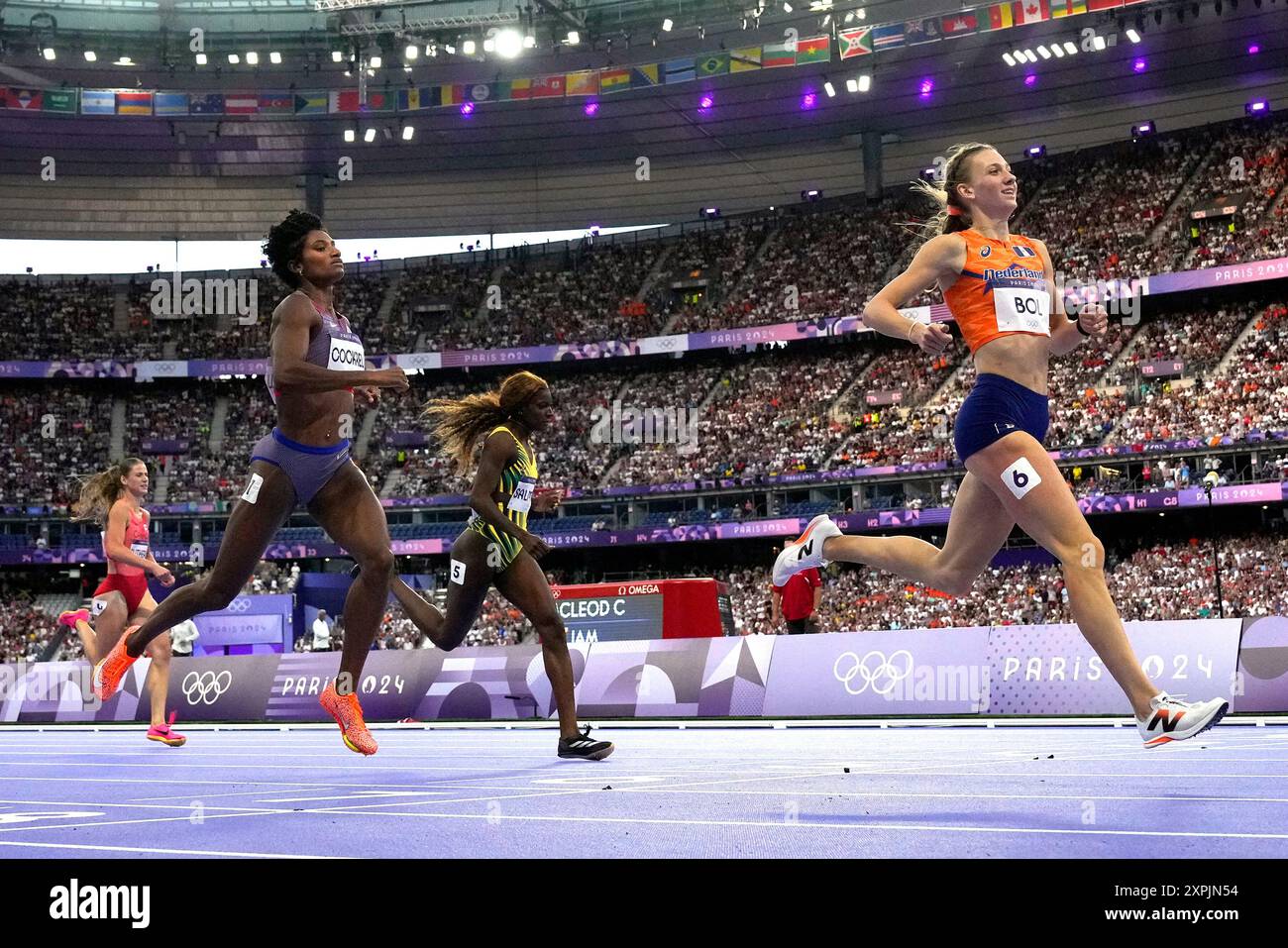 Femke Bol, right, of the Netherlands, leads Anna Cockrell, of the ...